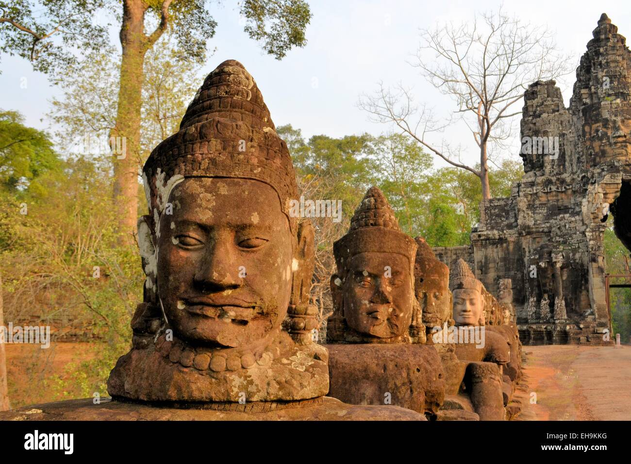 North gate to angkor thom in Cambodia is lined with warriors and demons ...
