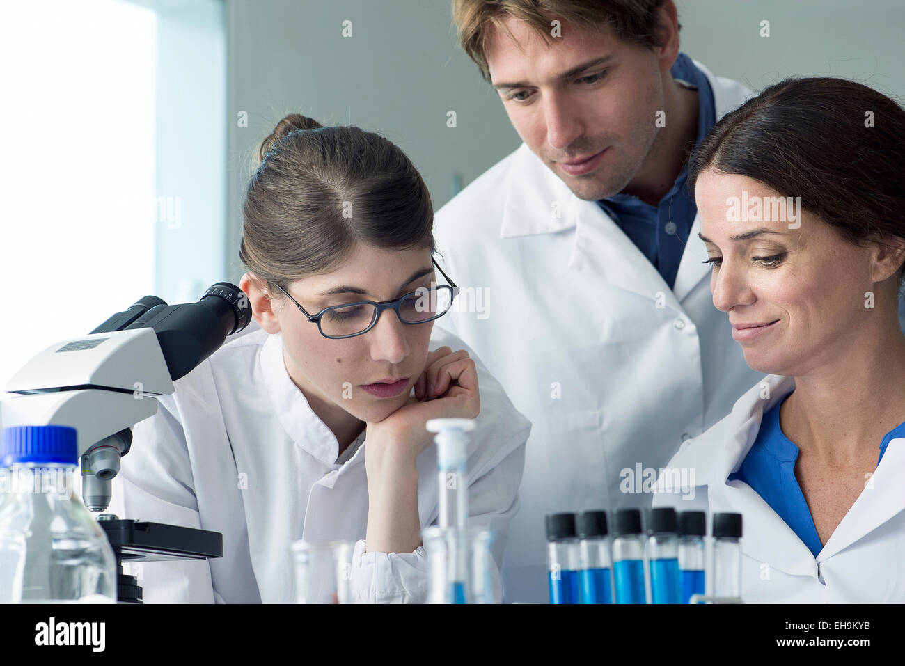 Scientists conducting experiment in laboratory Stock Photo - Alamy