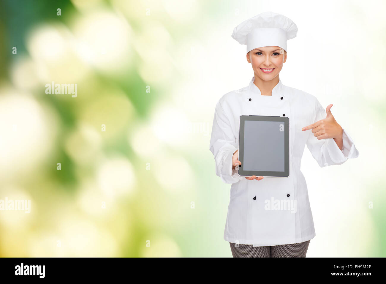 smiling female chef with tablet pc blank screen Stock Photo - Alamy