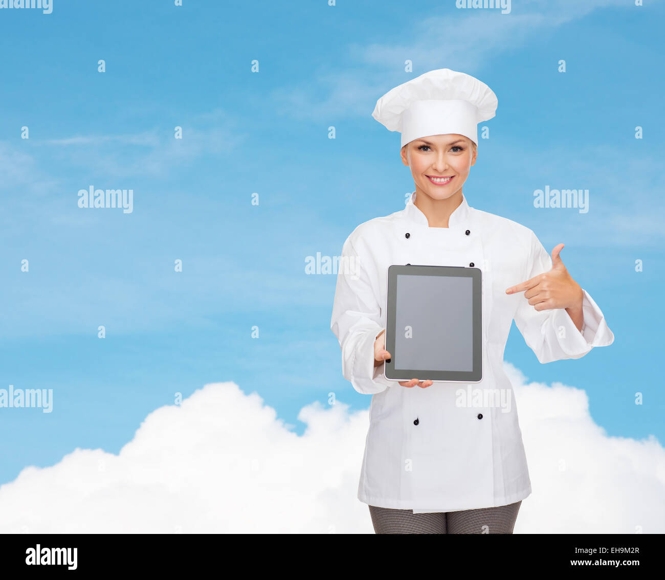 smiling female chef with tablet pc blank screen Stock Photo - Alamy