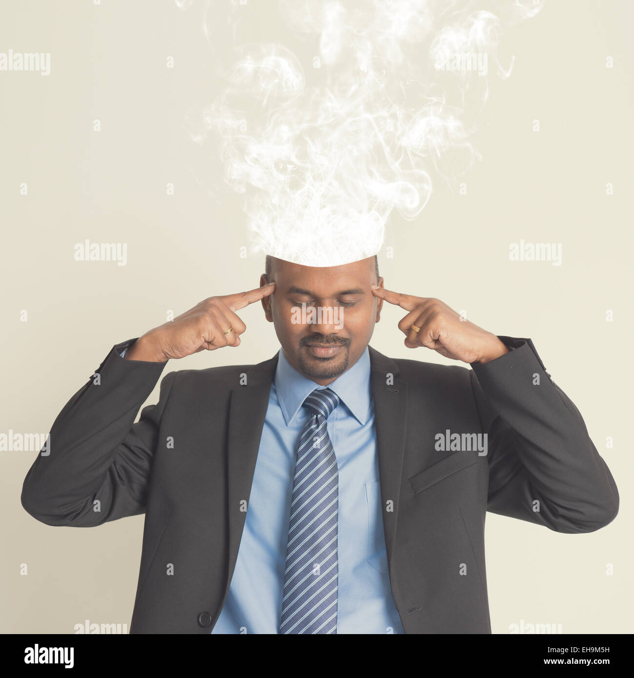 Businessman head burnout, smoke coming out from head Stock Photo - Alamy