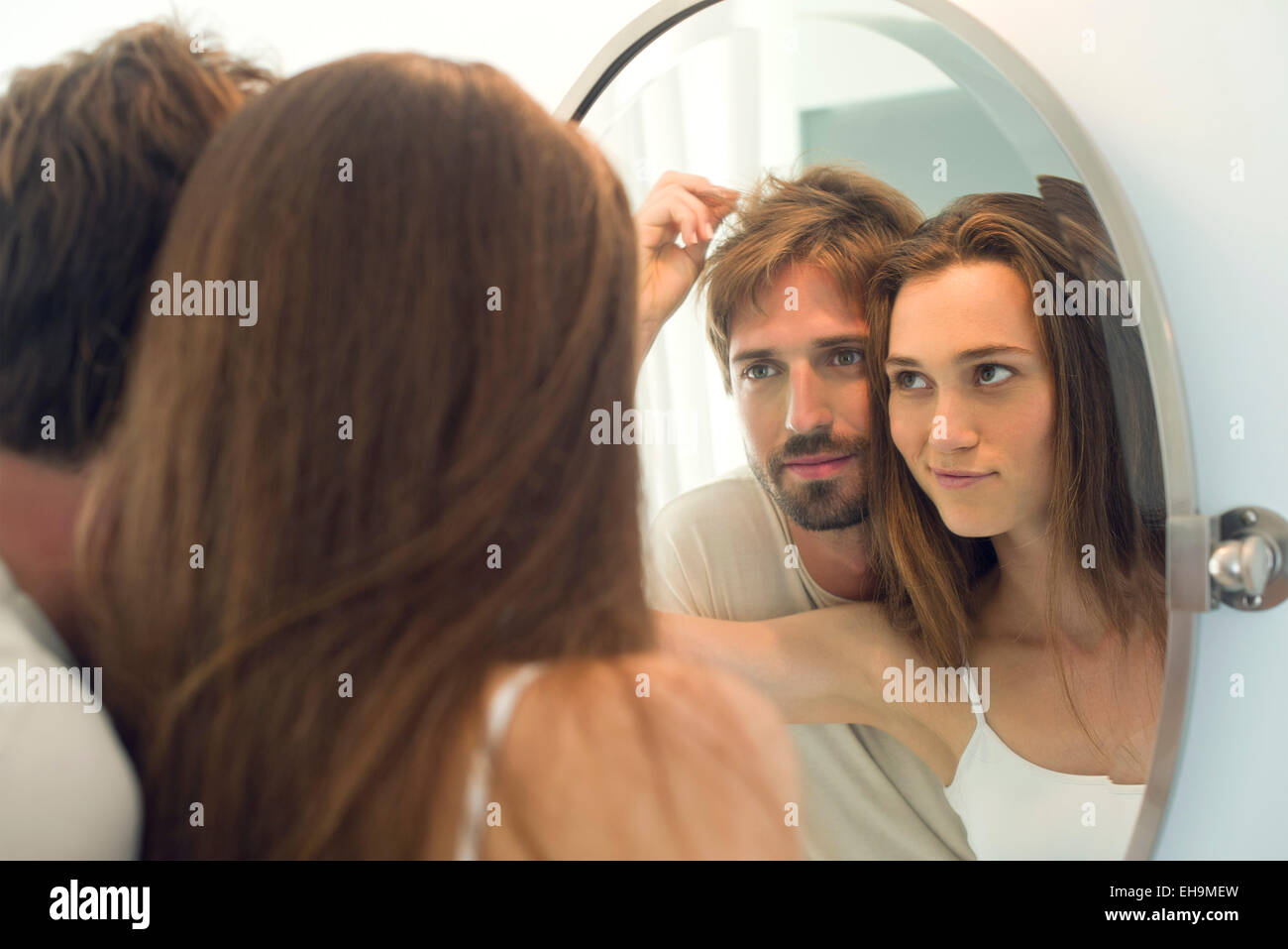 Woman looks over husbands hi-res stock photography and images - Alamy