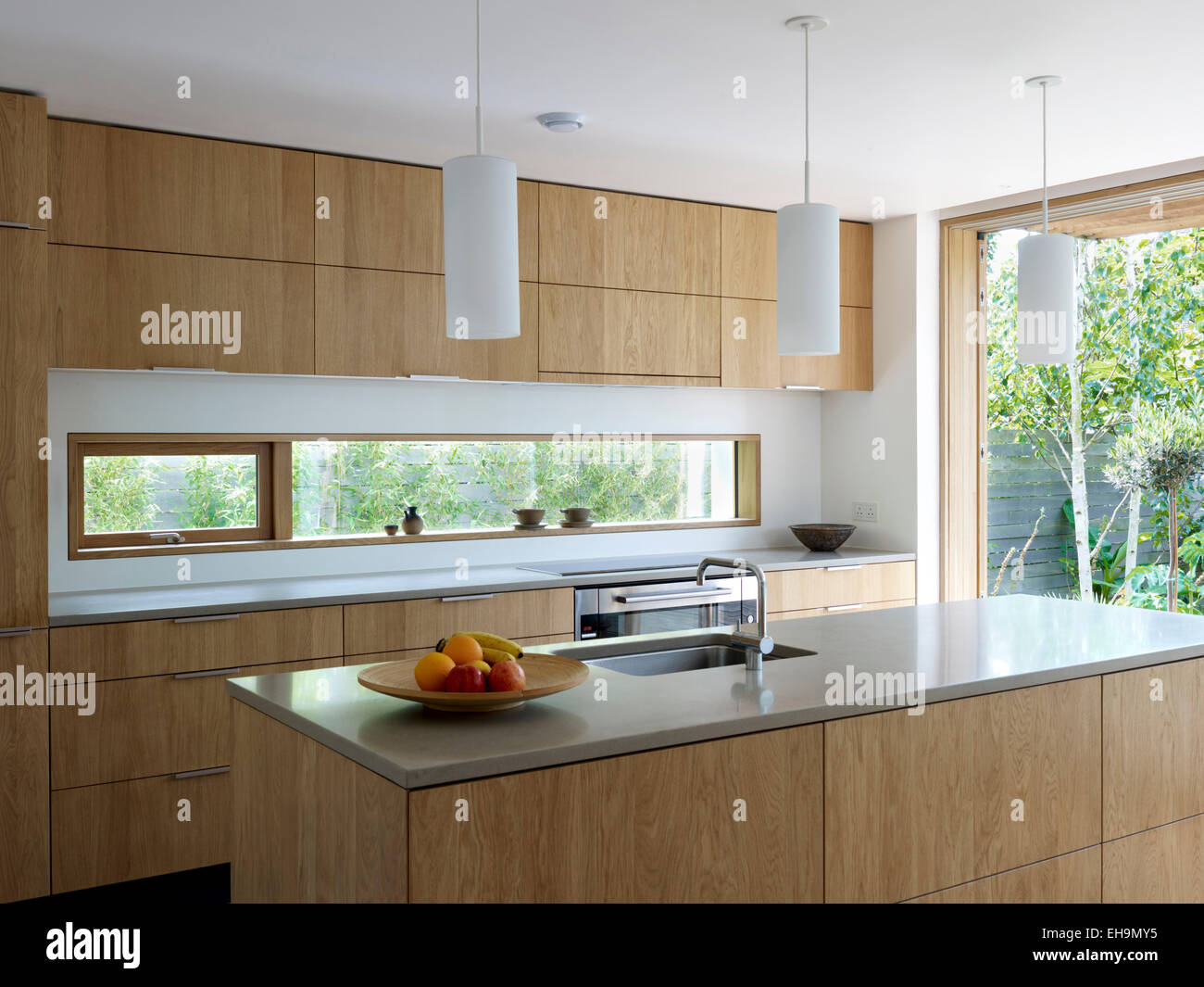 White and brown kitchen with island unit, residential house, Lloyd ...