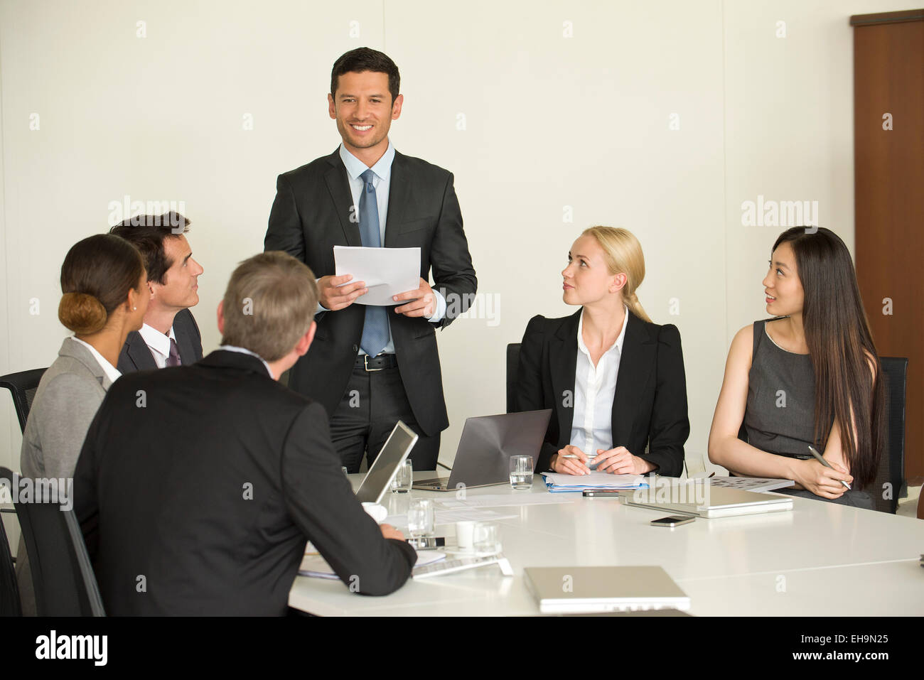 Executive giving presentation in meeting Stock Photo - Alamy