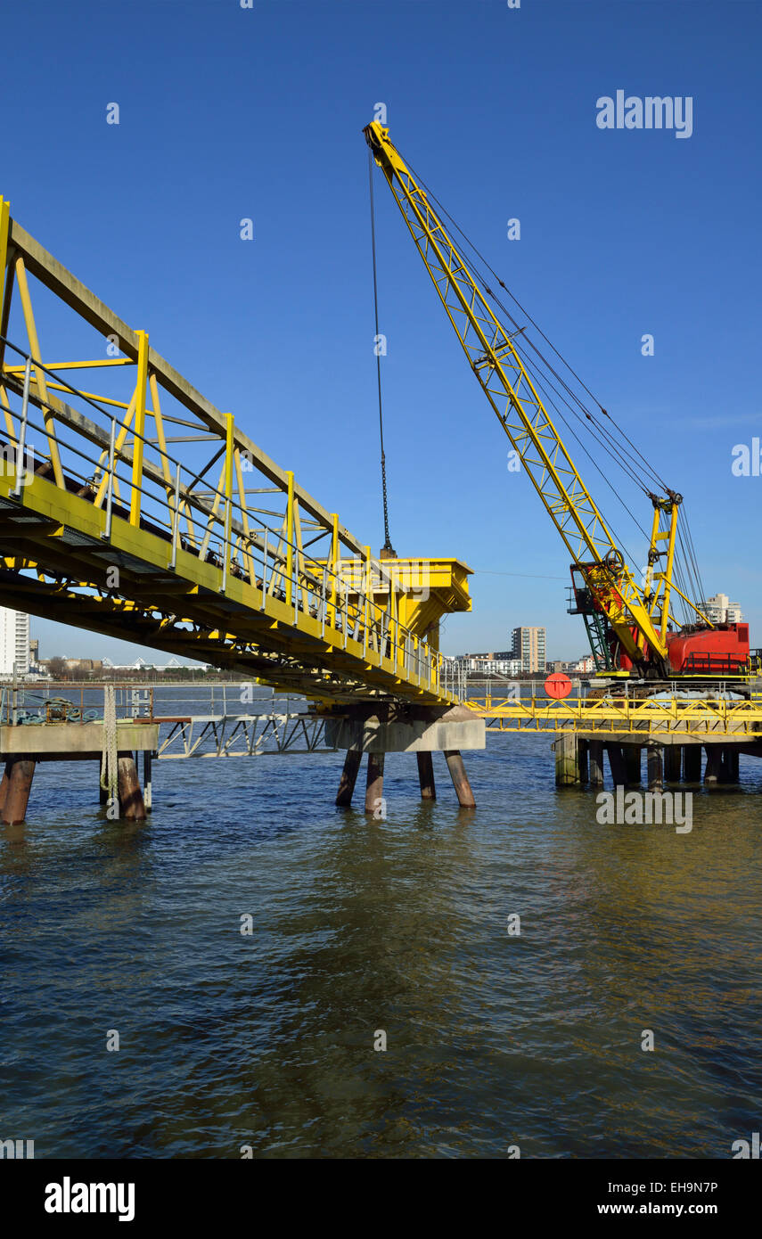 Crane loading for aggregate ships, Thames River, London, United Kingdom ...