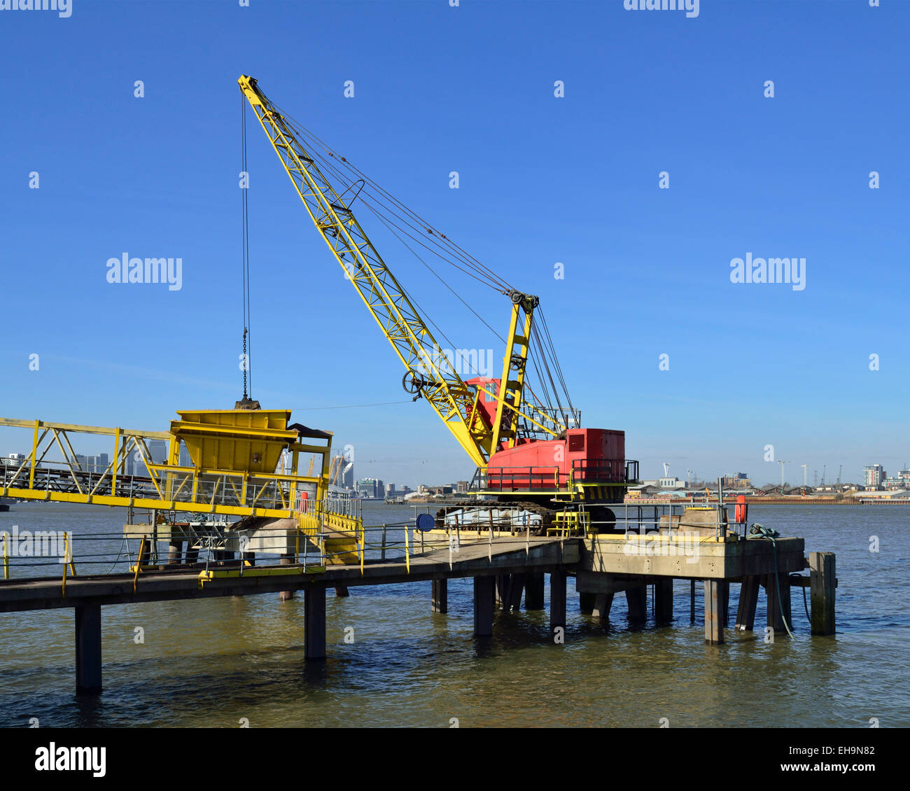 Crane loading for aggregate ships, Thames River, London, United Kingdom ...