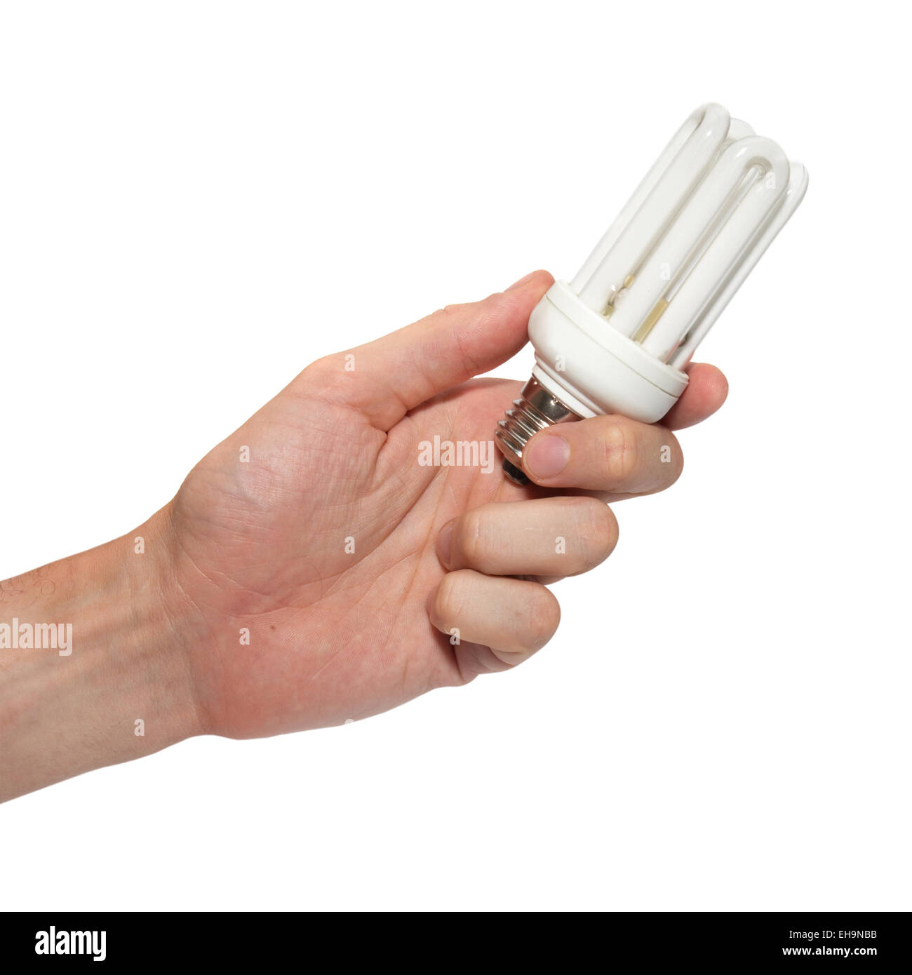Economy lamp in a hand isolated on white Stock Photo - Alamy