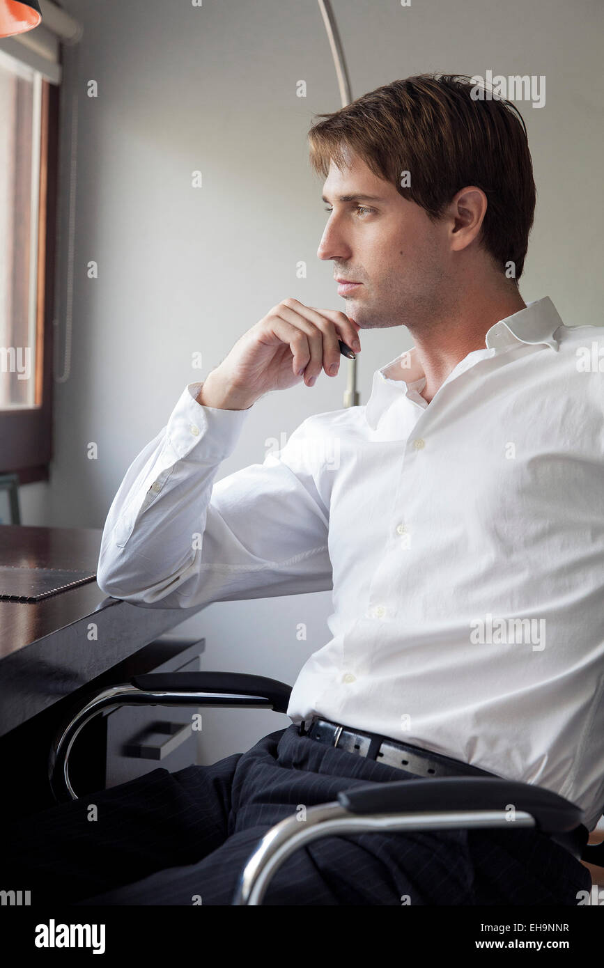 Man at desk contemplating Stock Photo, Royalty Free Image: 79505267 - Alamy