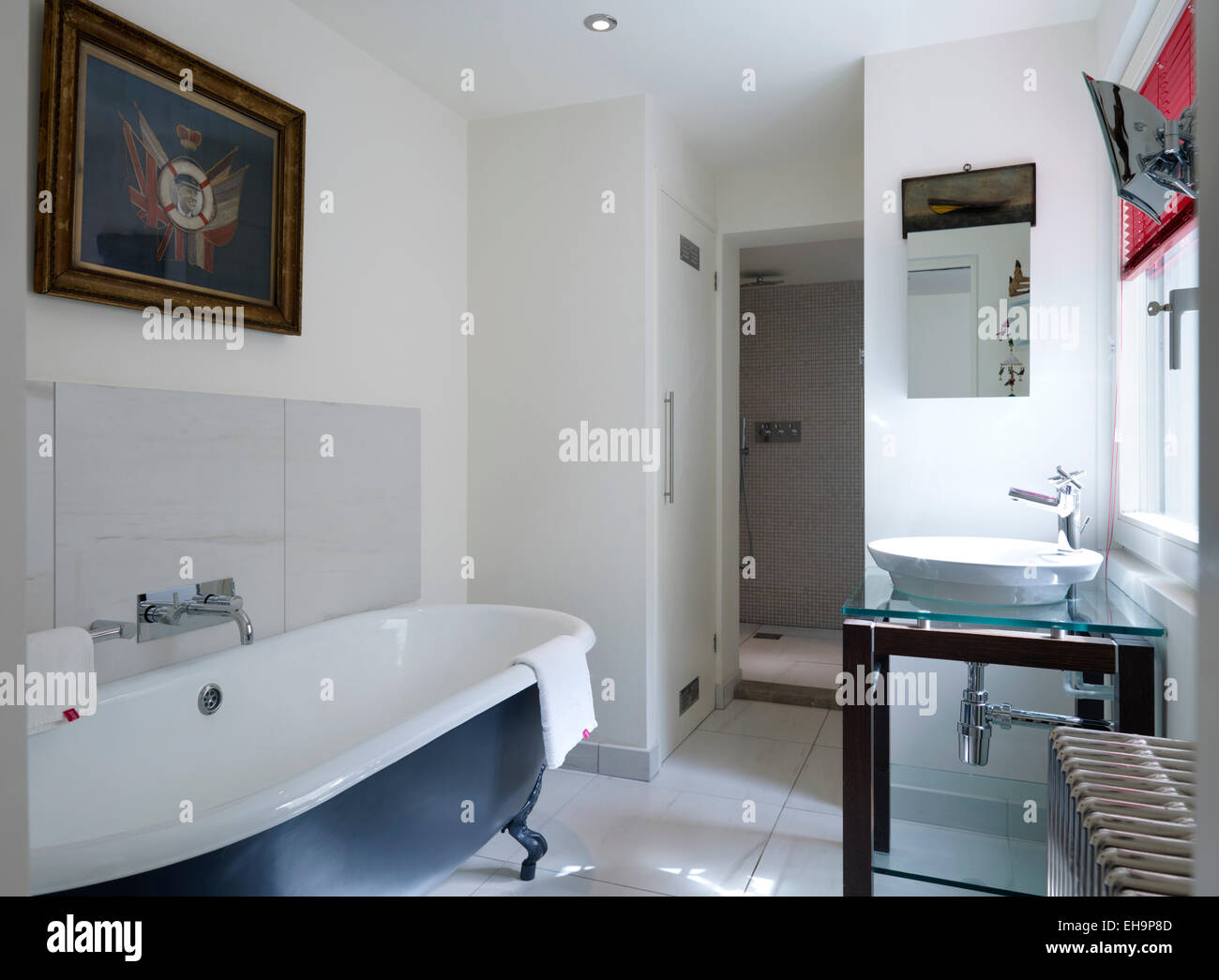 Modern bathroom with standing bath tub and basin of George Street home ...