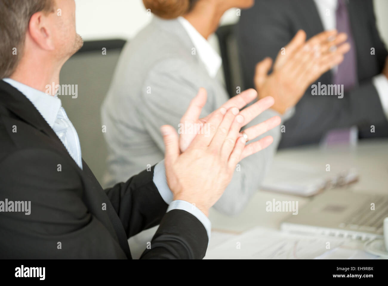 Executives clapping in meeting Stock Photo - Alamy