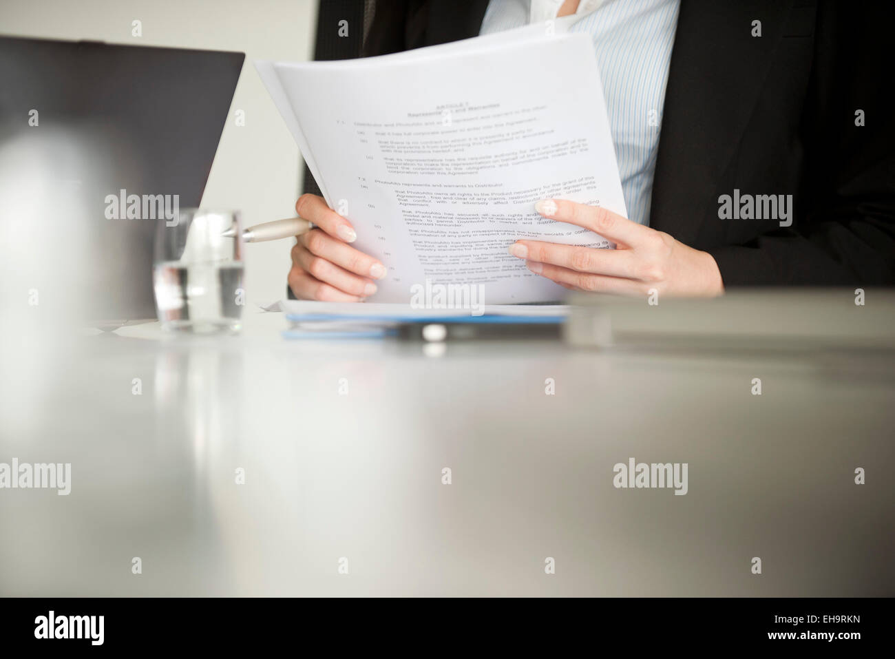 Executive reviewing document, cropped Stock Photo - Alamy