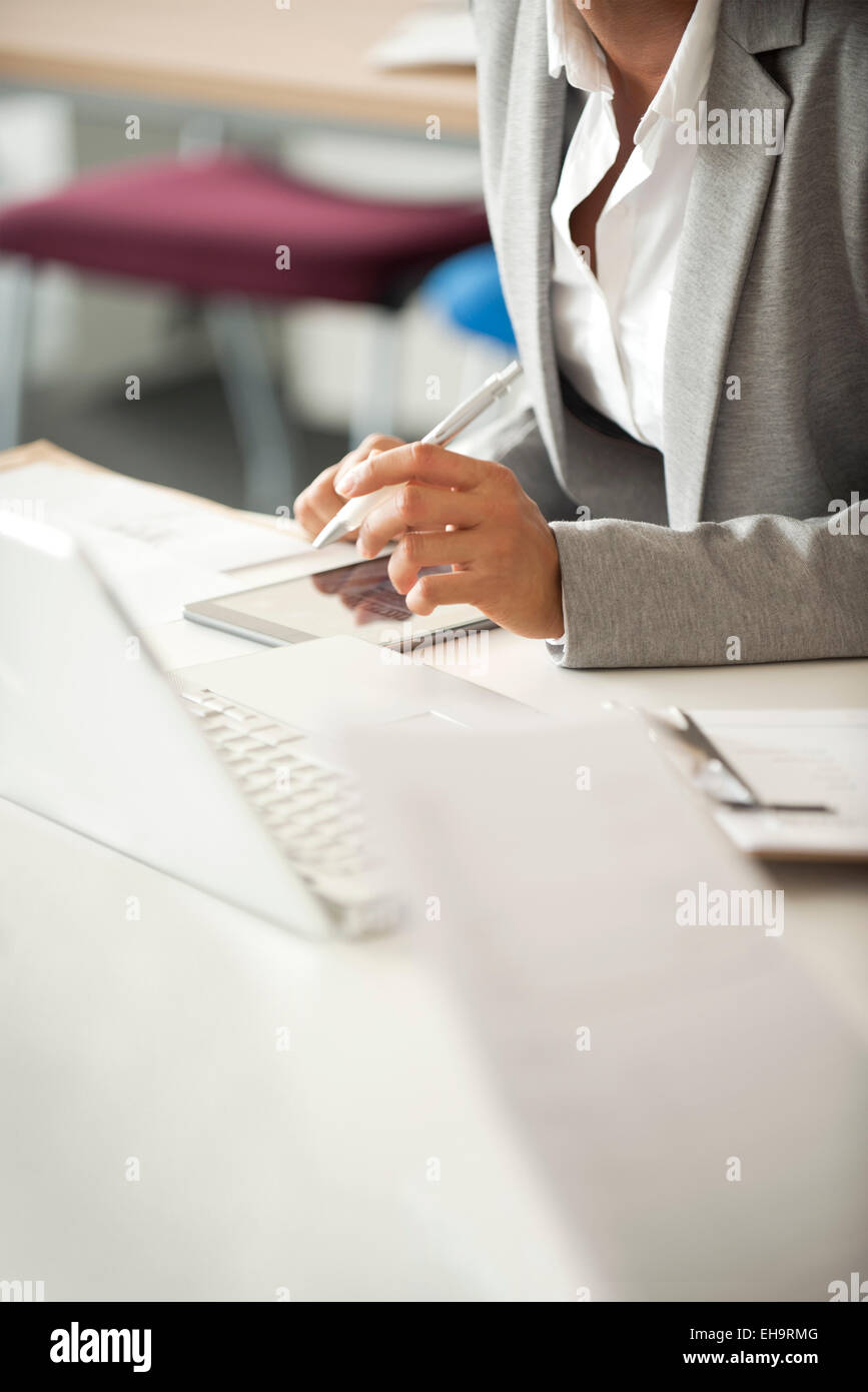 Businesswoman taking notes at meeting, cropped Stock Photo - Alamy