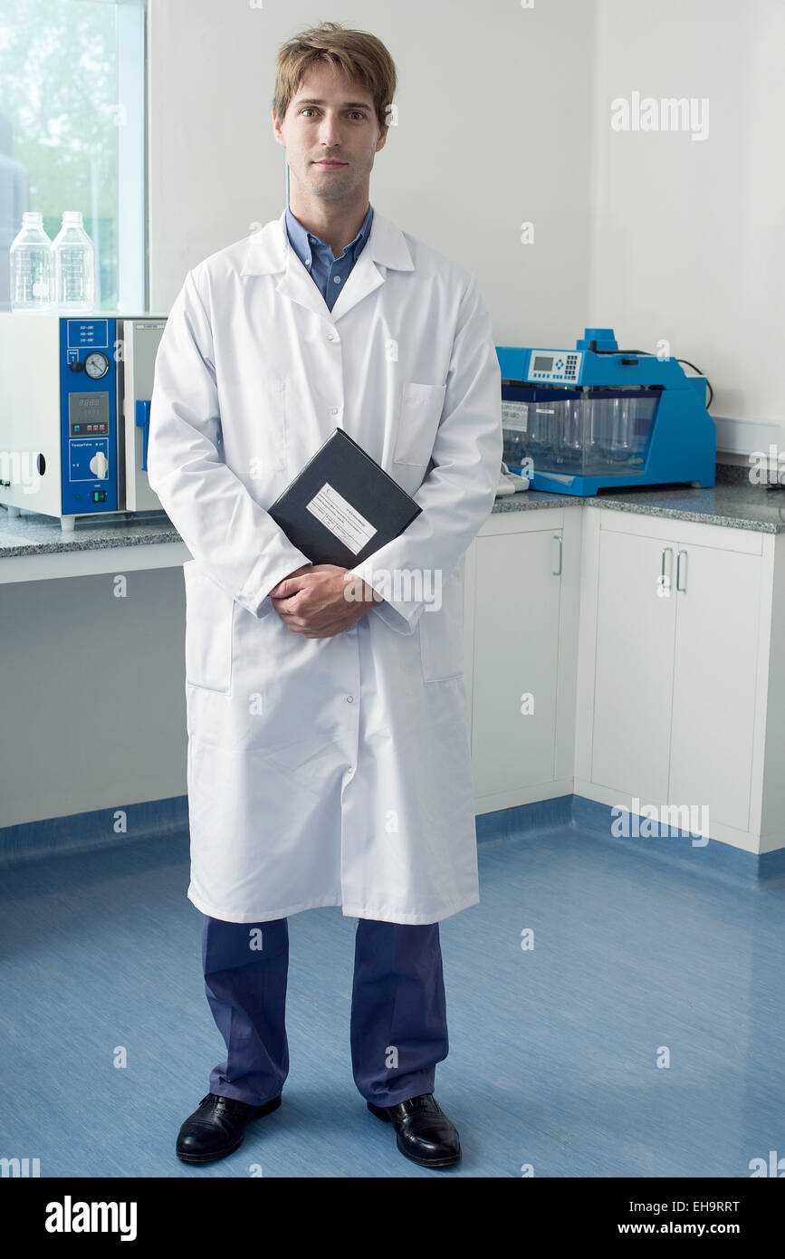 Scientist standing in lab, portrait Stock Photo - Alamy