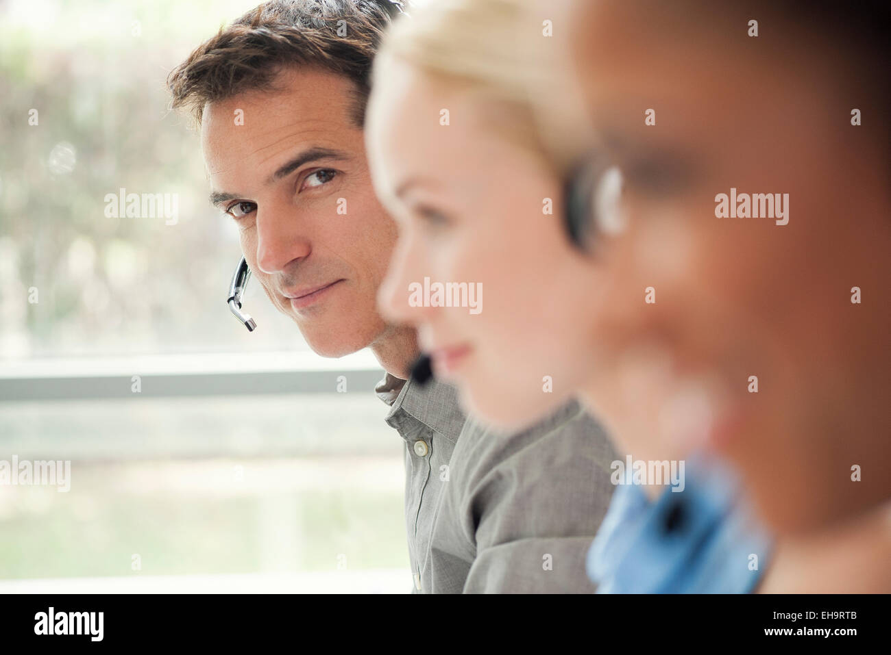 Working in call center Stock Photo - Alamy