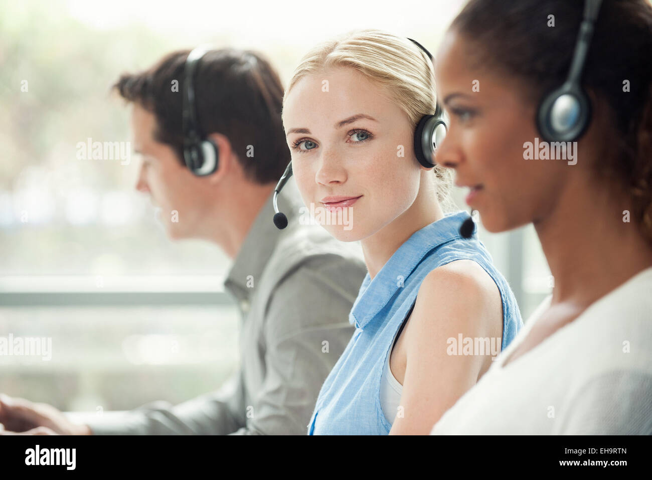 Working in call center Stock Photo - Alamy