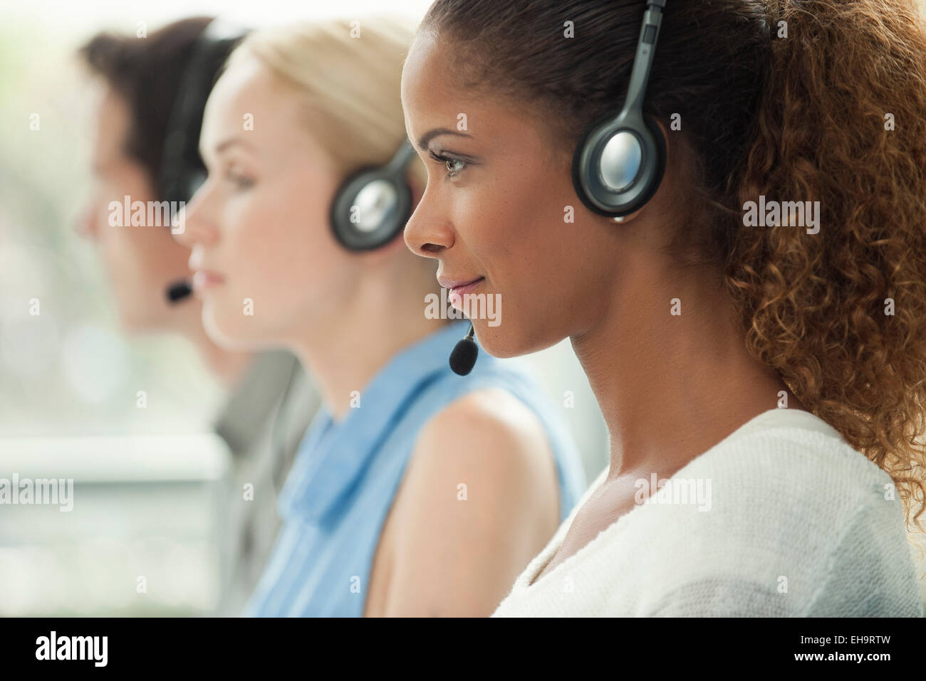 Working in call center Stock Photo - Alamy