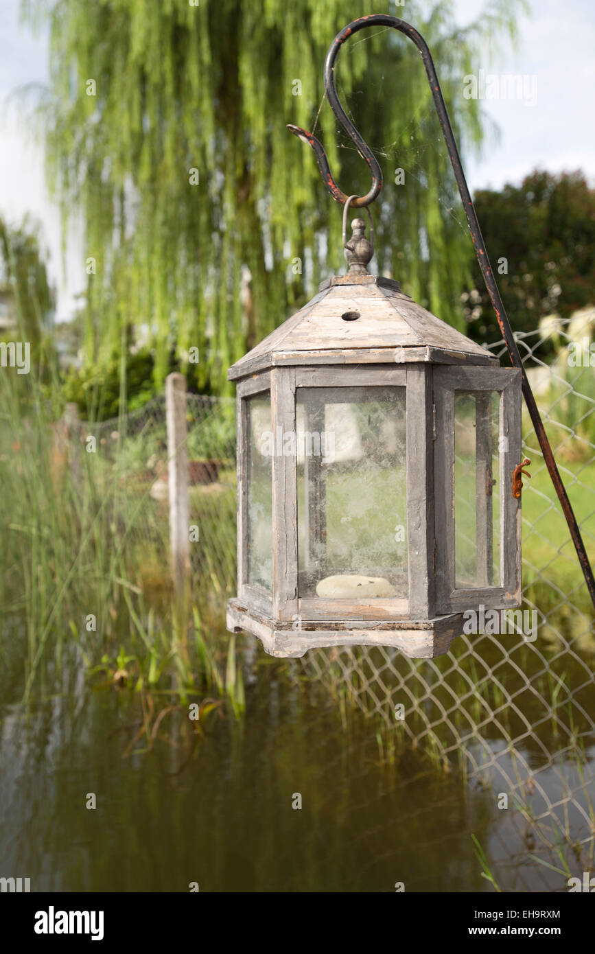 Old-fashioned lantern hanging over lake Stock Photo - Alamy