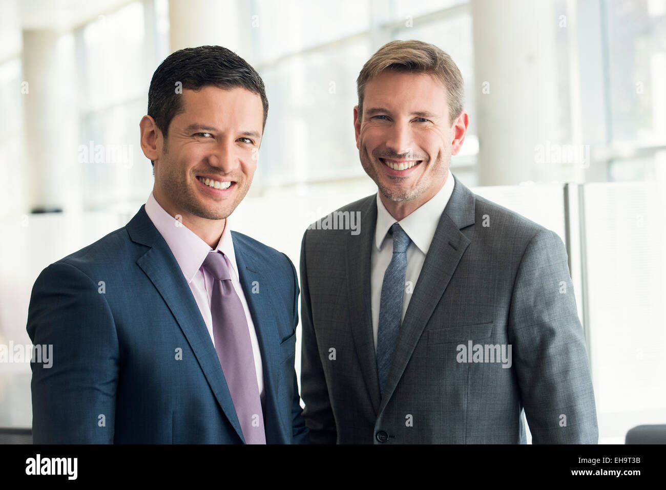 Businessmen smiling, portrait Stock Photo - Alamy