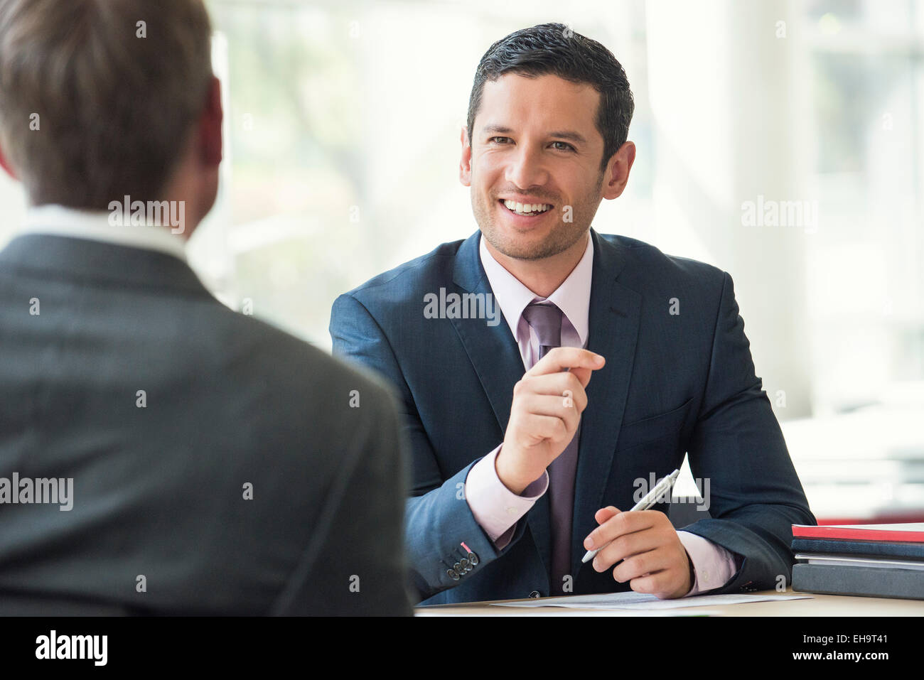 Businessman meeting with client Stock Photo - Alamy