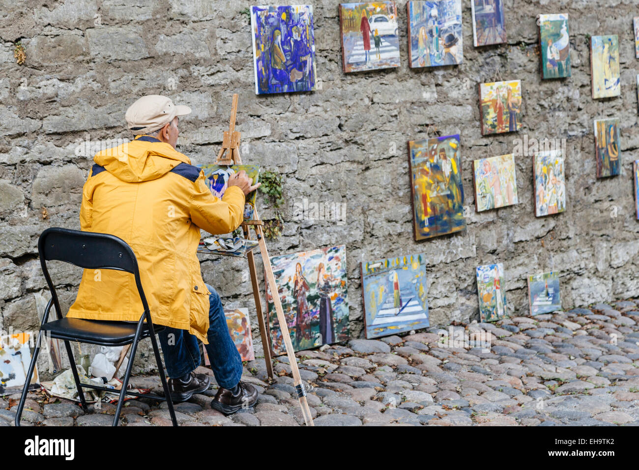 Outdoor artist painting and selling paintings on Pikk Jelg street in ...