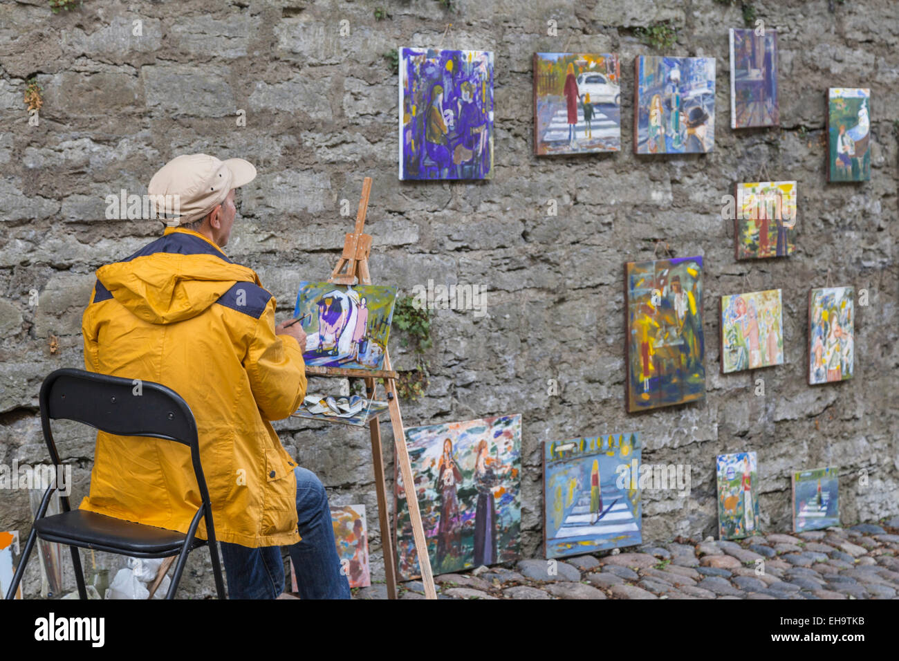 Outdoor artist painting and selling paintings on Pikk Jelg street in ...