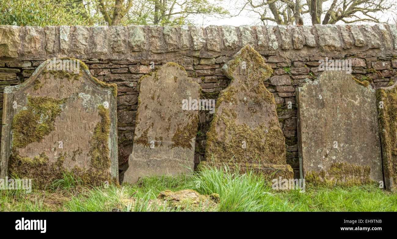 Ancient and weathered headstones in the churchyard of Hardraw Church ...