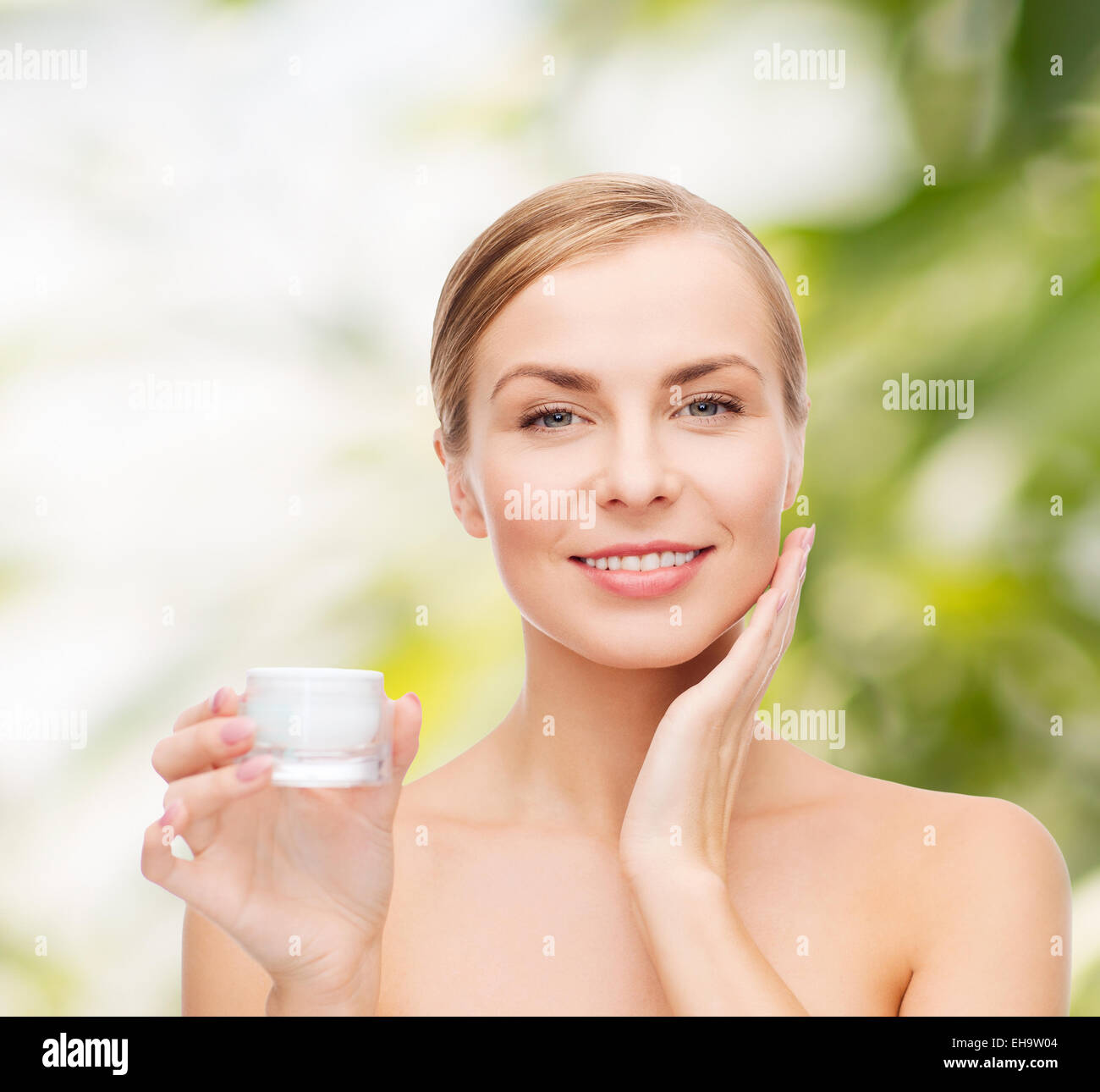 woman applying cream on her skin Stock Photo - Alamy