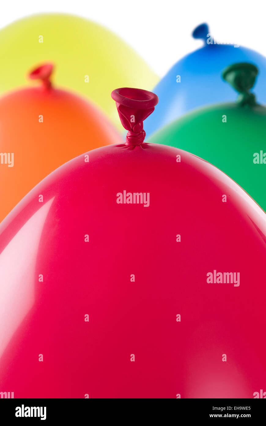 Colorful balloons in a row close up Stock Photo - Alamy