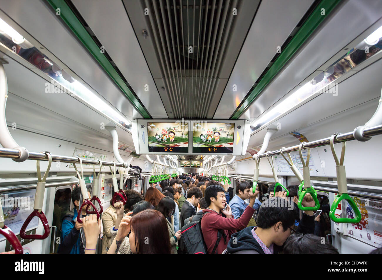 Seoul, South Korea - October 24, 2014: A crowded train carriage at rush ...