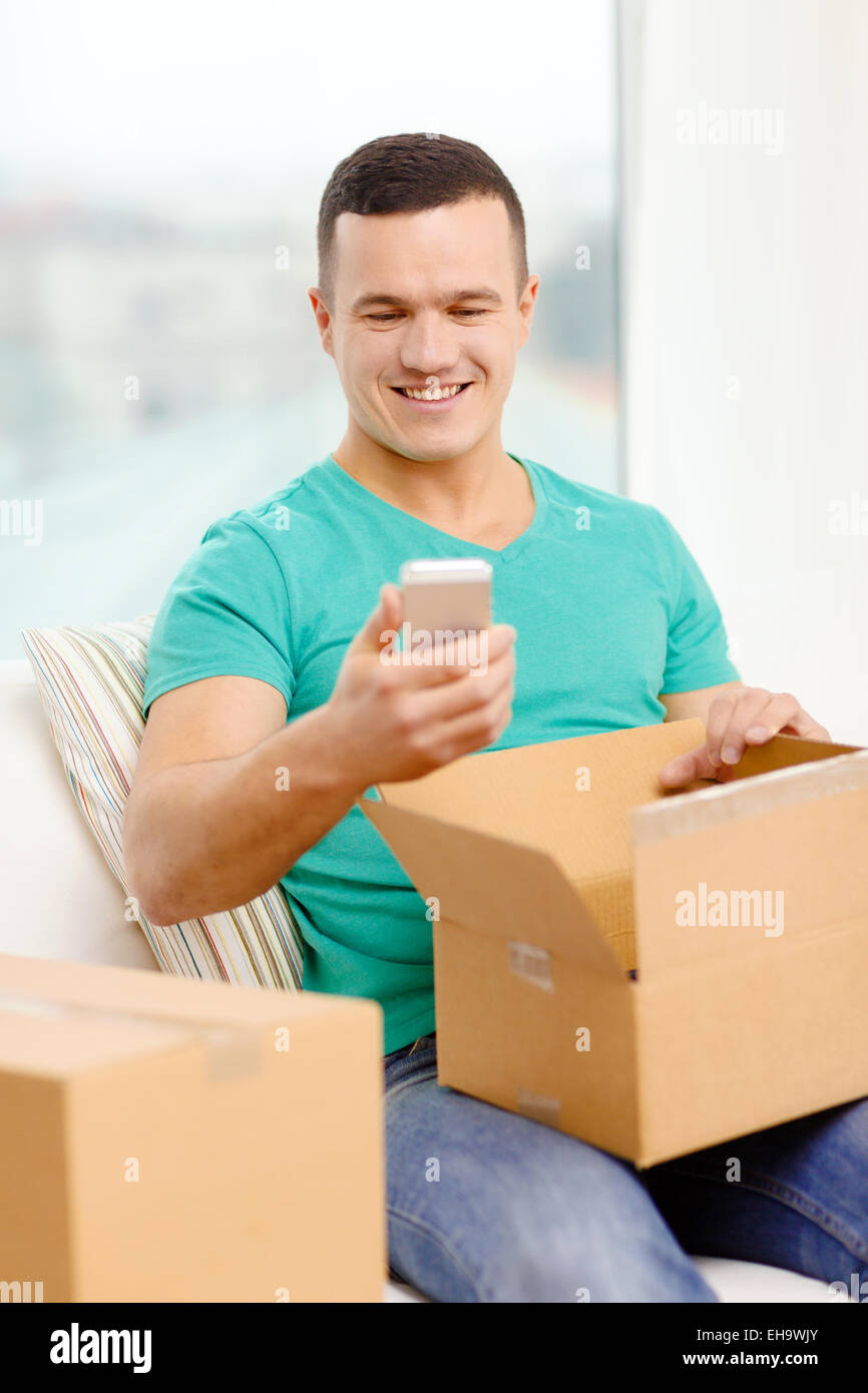 opening cardboard box and taking out smartphone Stock Photo - Alamy