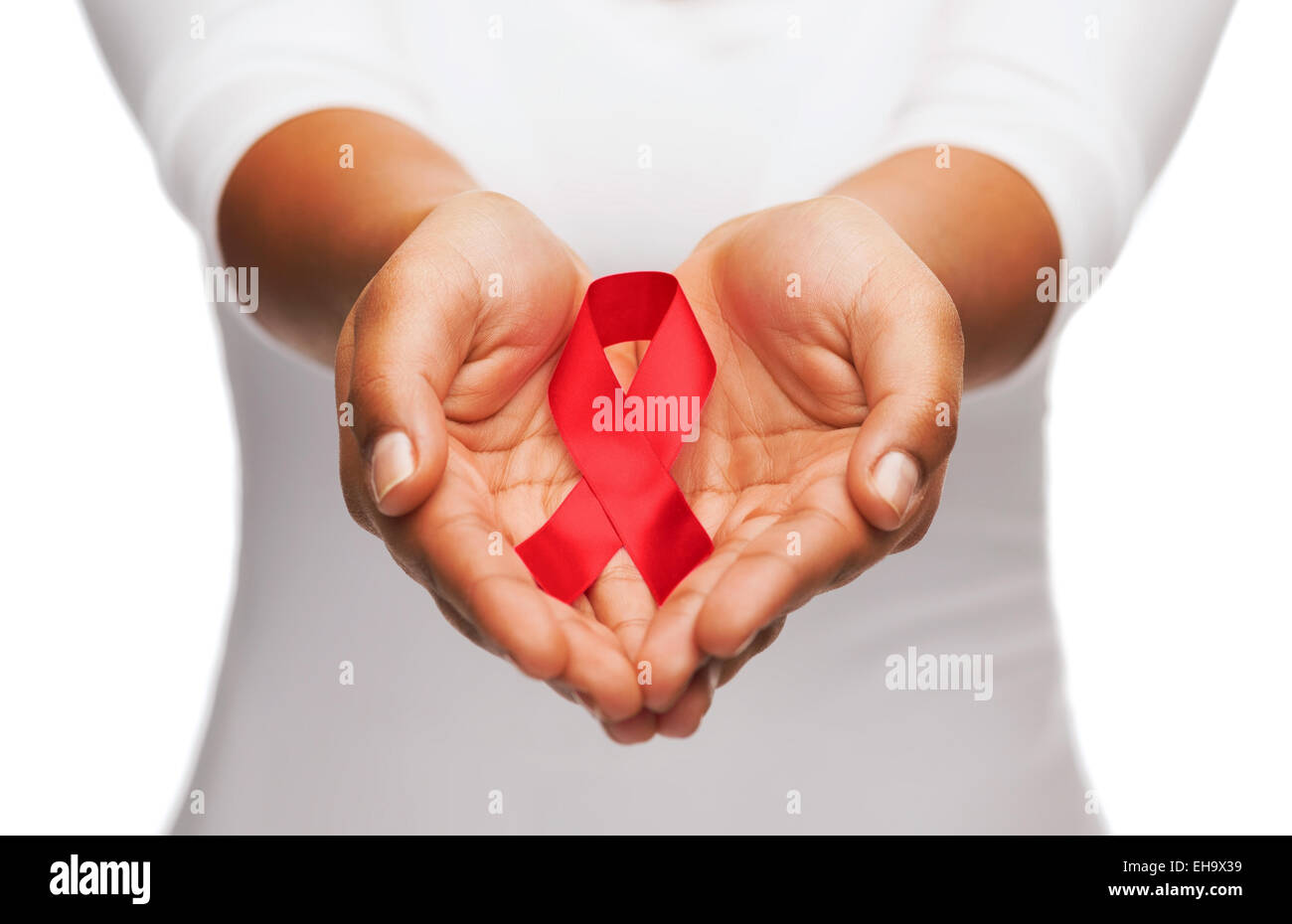 hands holding red AIDS awareness ribbon Stock Photo - Alamy