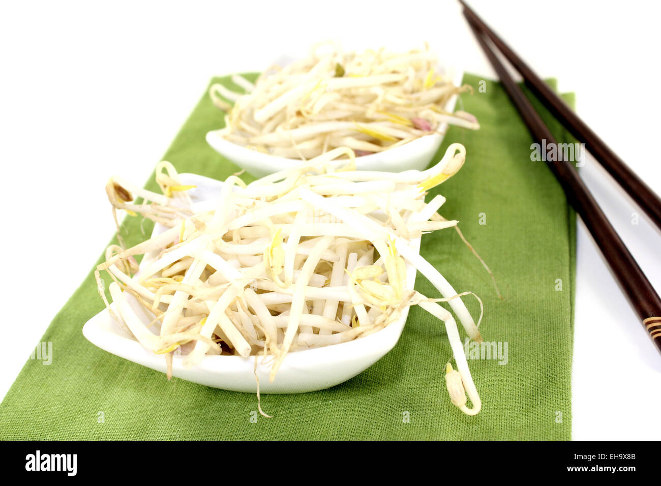 mung bean sprouts with chopsticks on a light background Stock Photo - Alamy