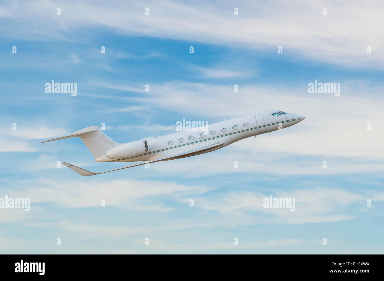 Private jet flying in sky Stock Photo - Alamy
