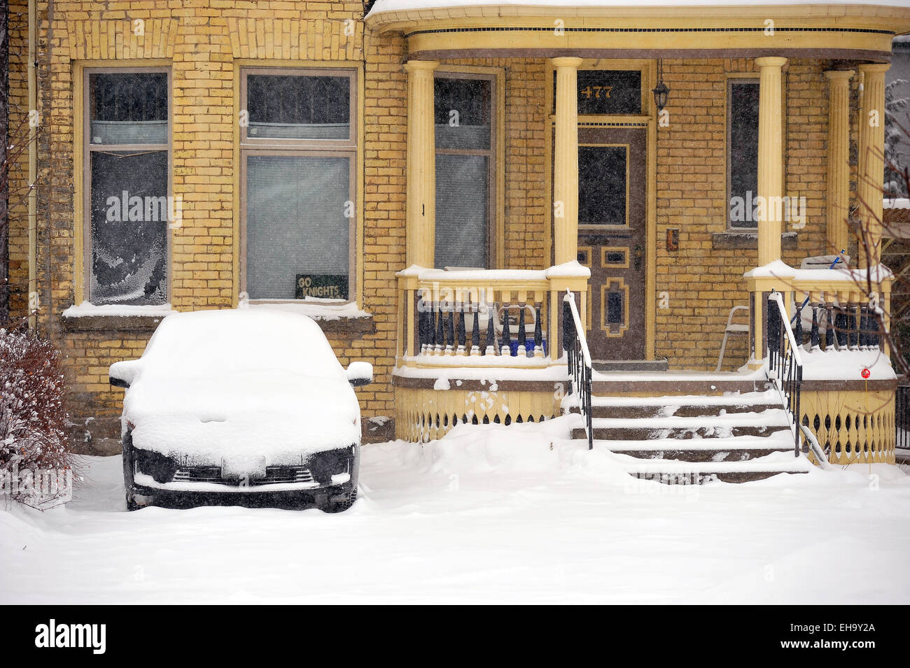 A snow covered car parked in a home driveway in Canada Stock Photo - Alamy