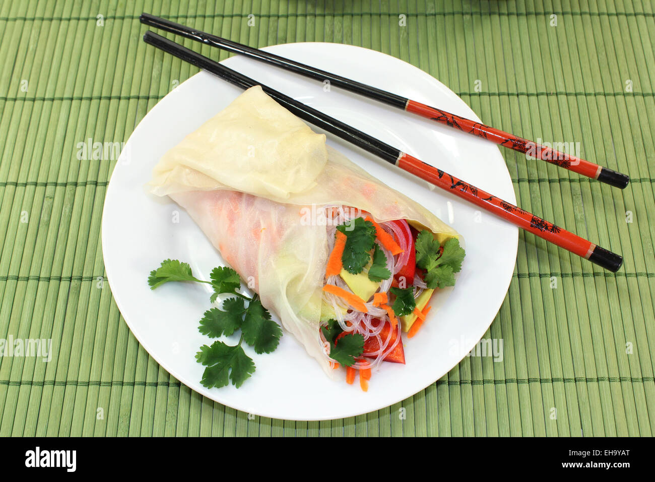 Rice paper stuffed with glass noodles, carrots, peppers and cilantro ...