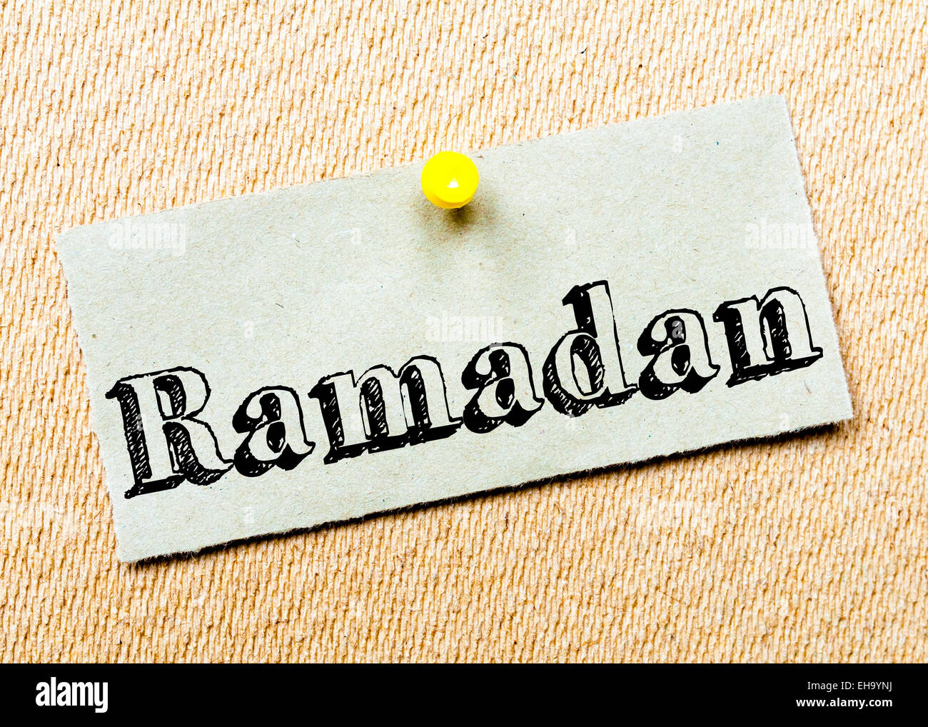 Recycled paper note pinned on cork board. Ramadan Message. Concept ...