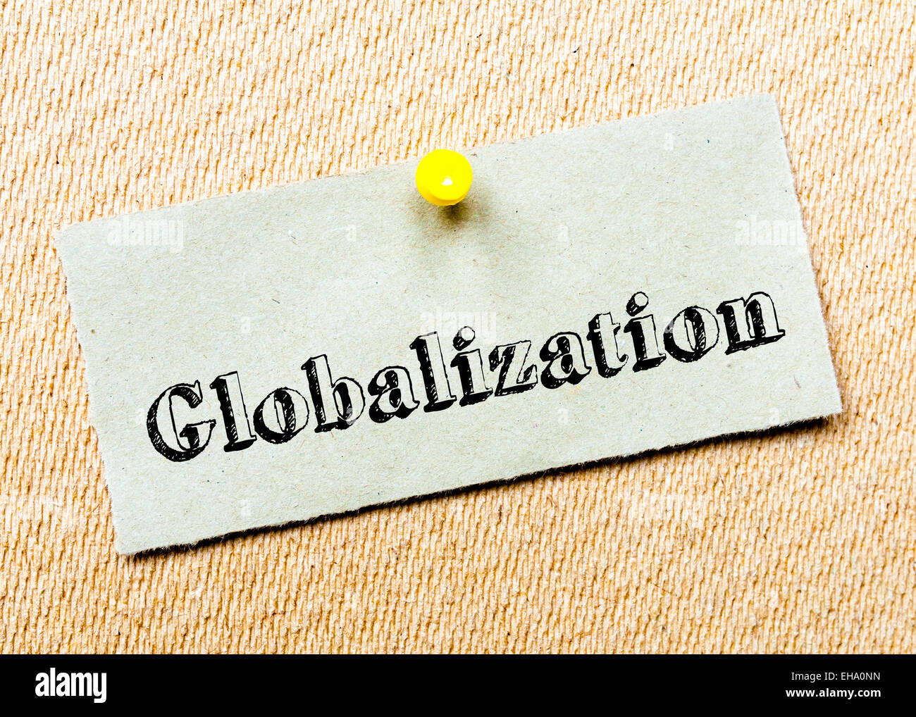 Recycled paper note pinned on cork board. Globalization Message ...