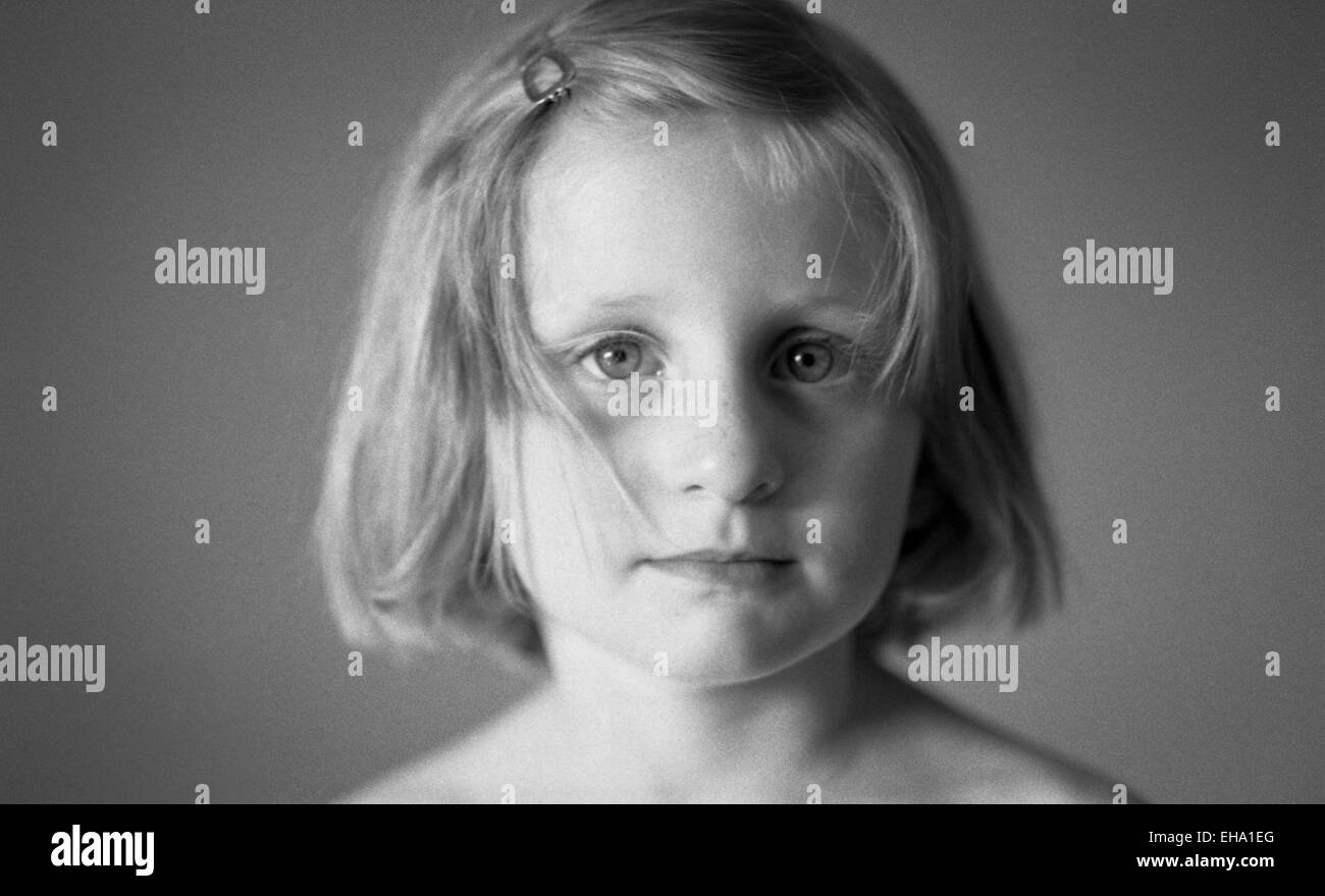 Young girl staring to camera Stock Photo - Alamy