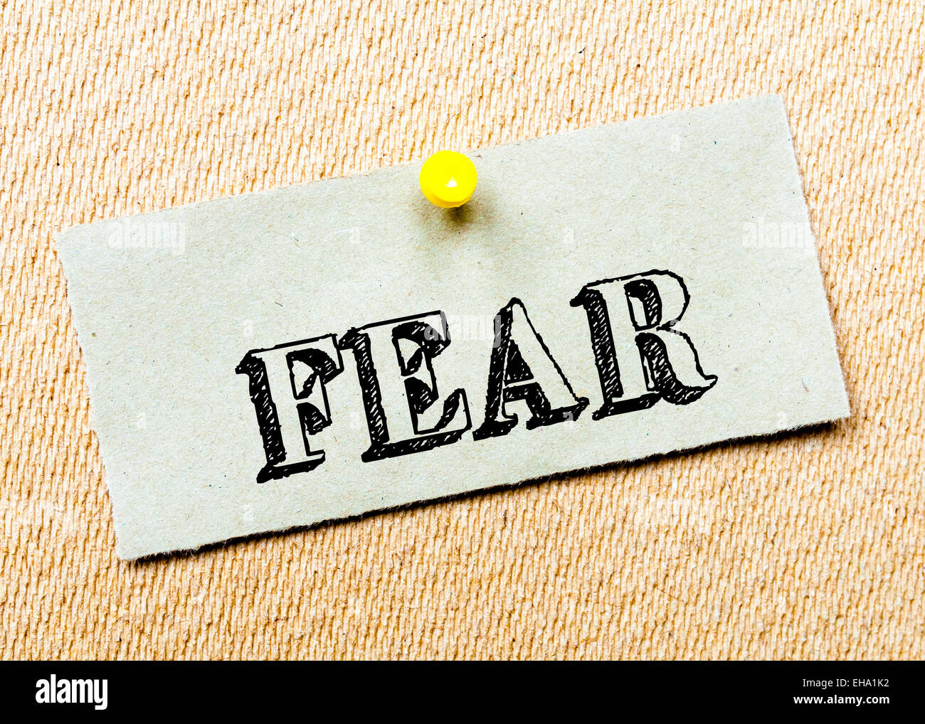 Recycled paper note pinned on cork board. Fear Message. Concept Image ...