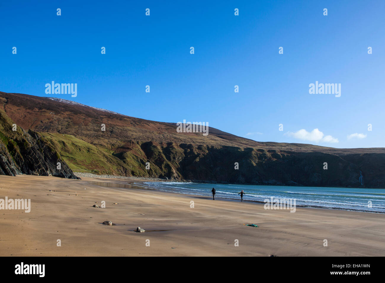 Two people on Silver Strand, Or Trabane Beach, near Malin Beg, Donegal ...