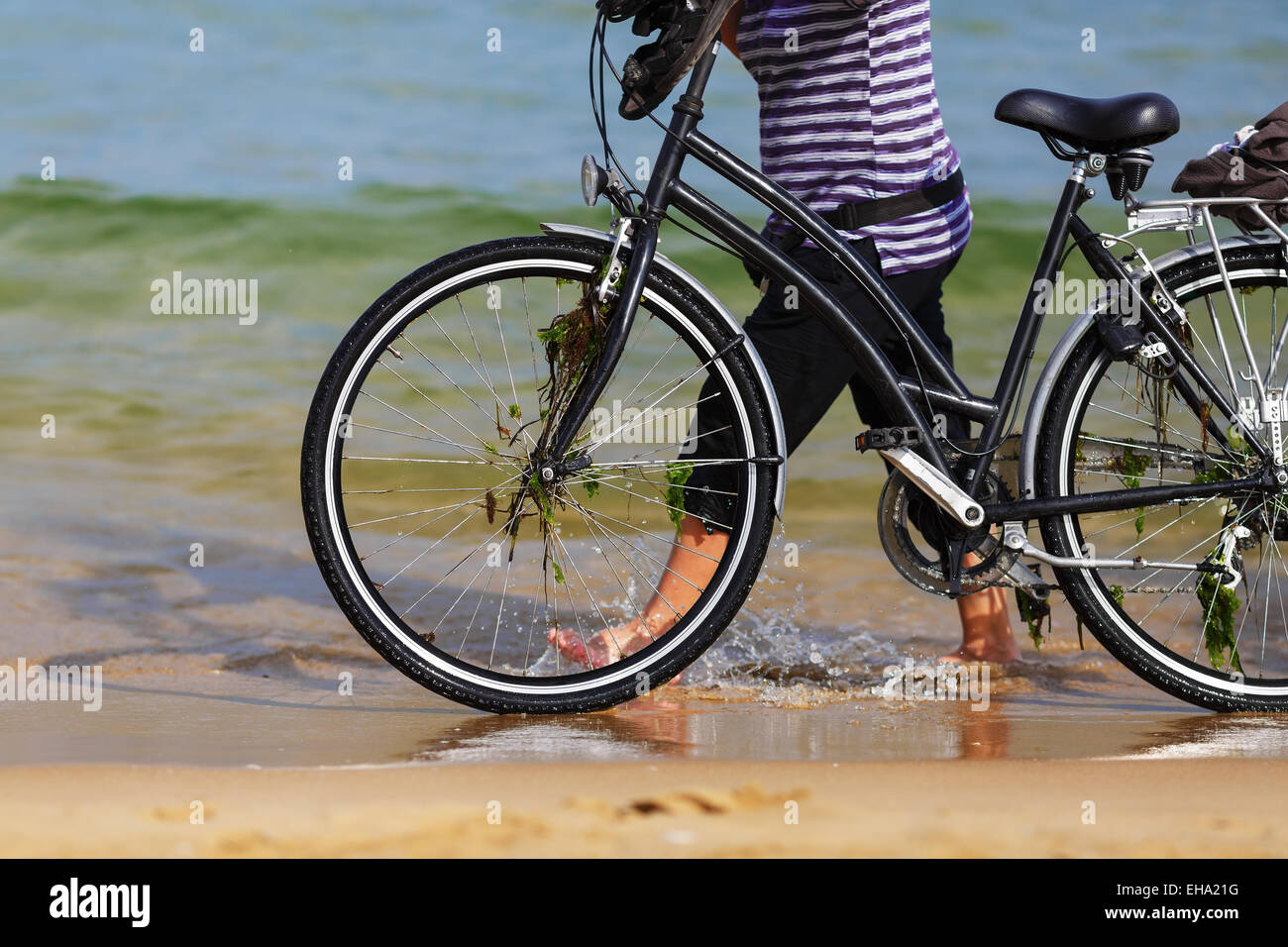 Walk along the beach with the bike. Shallow depth of field Stock Photo - Alamy