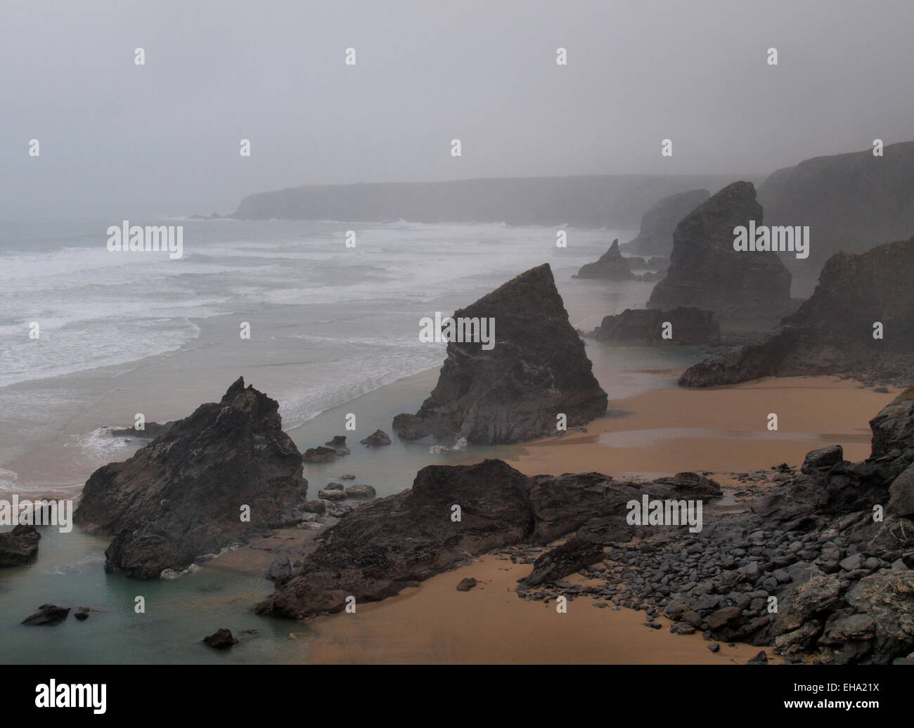 Sea stacks in the fog at Carnewas known as the Bedruthan Steps ...
