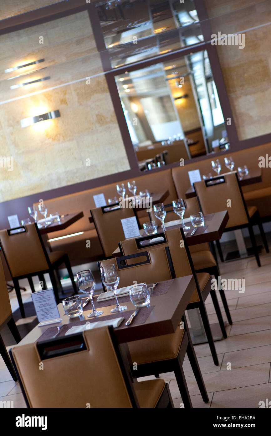 Table sets in the dining room of a restaurant Stock Photo - Alamy