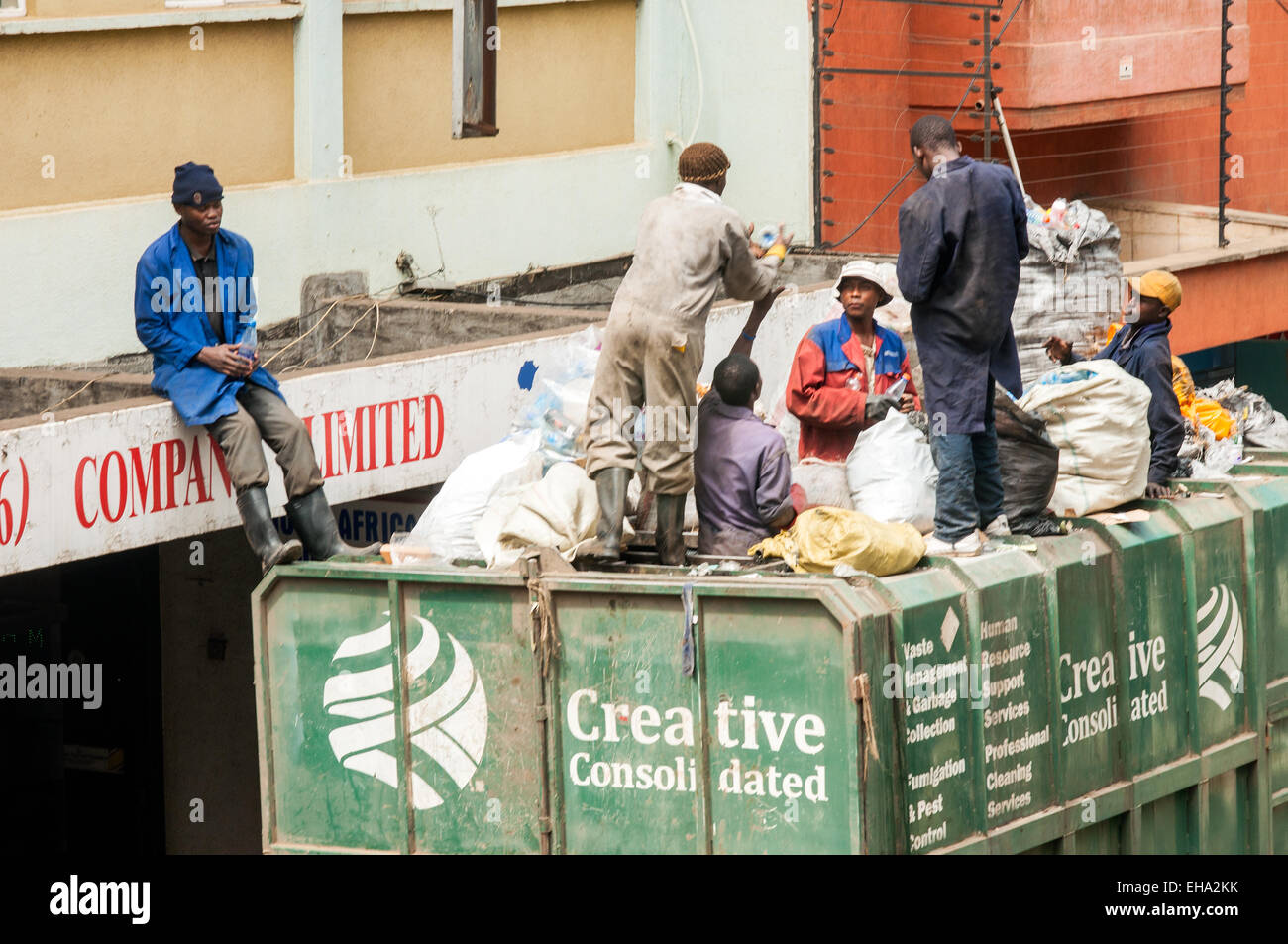 Waste disposal truck with workers, Debois Street, Downtown Nairobi ...