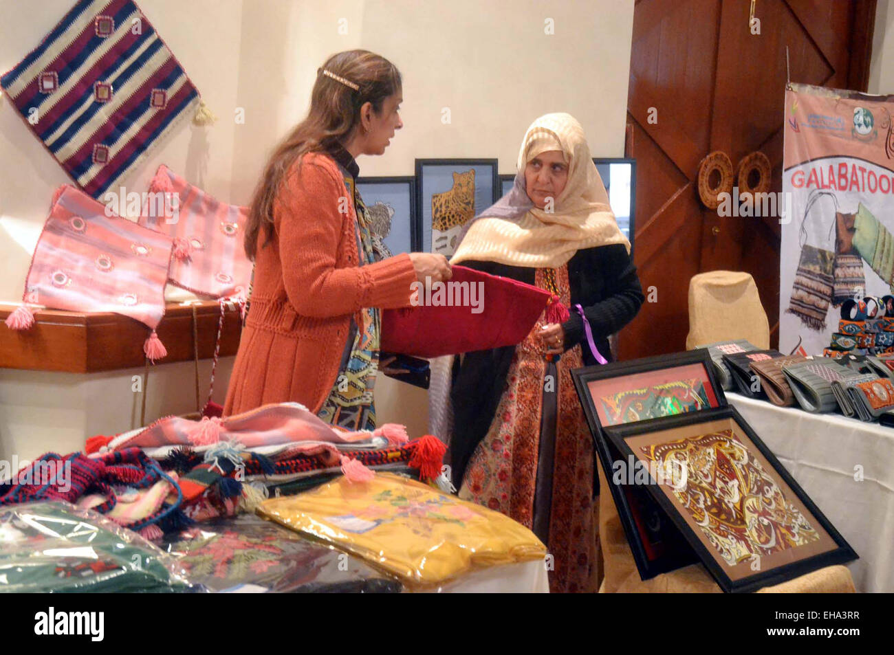 Quetta, Pakistan. 10th Mar, 2015. Visitors take keen interest at stall ...