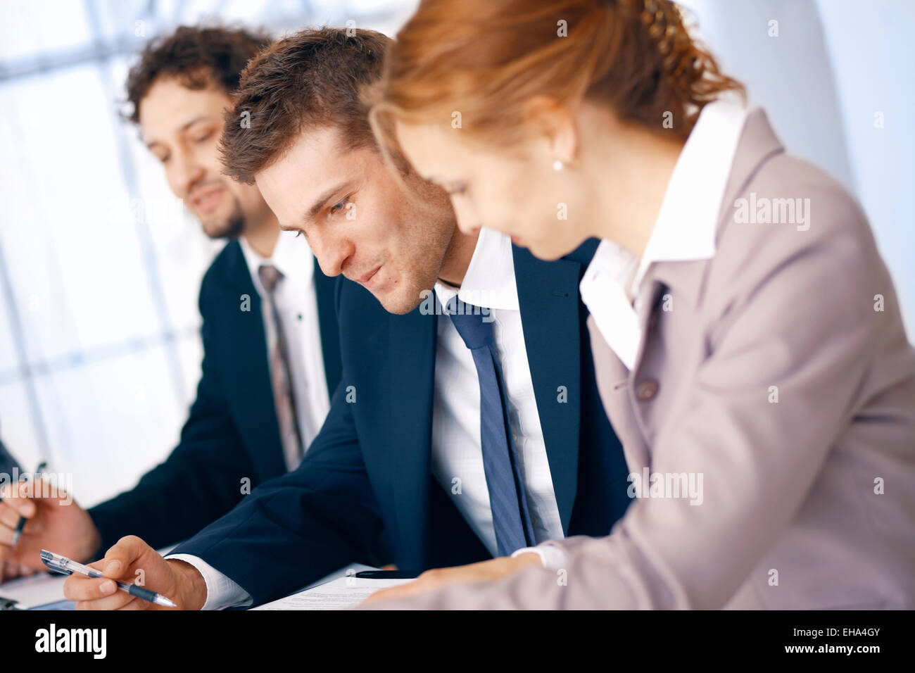 Group of business people working on some documents at the office Stock ...