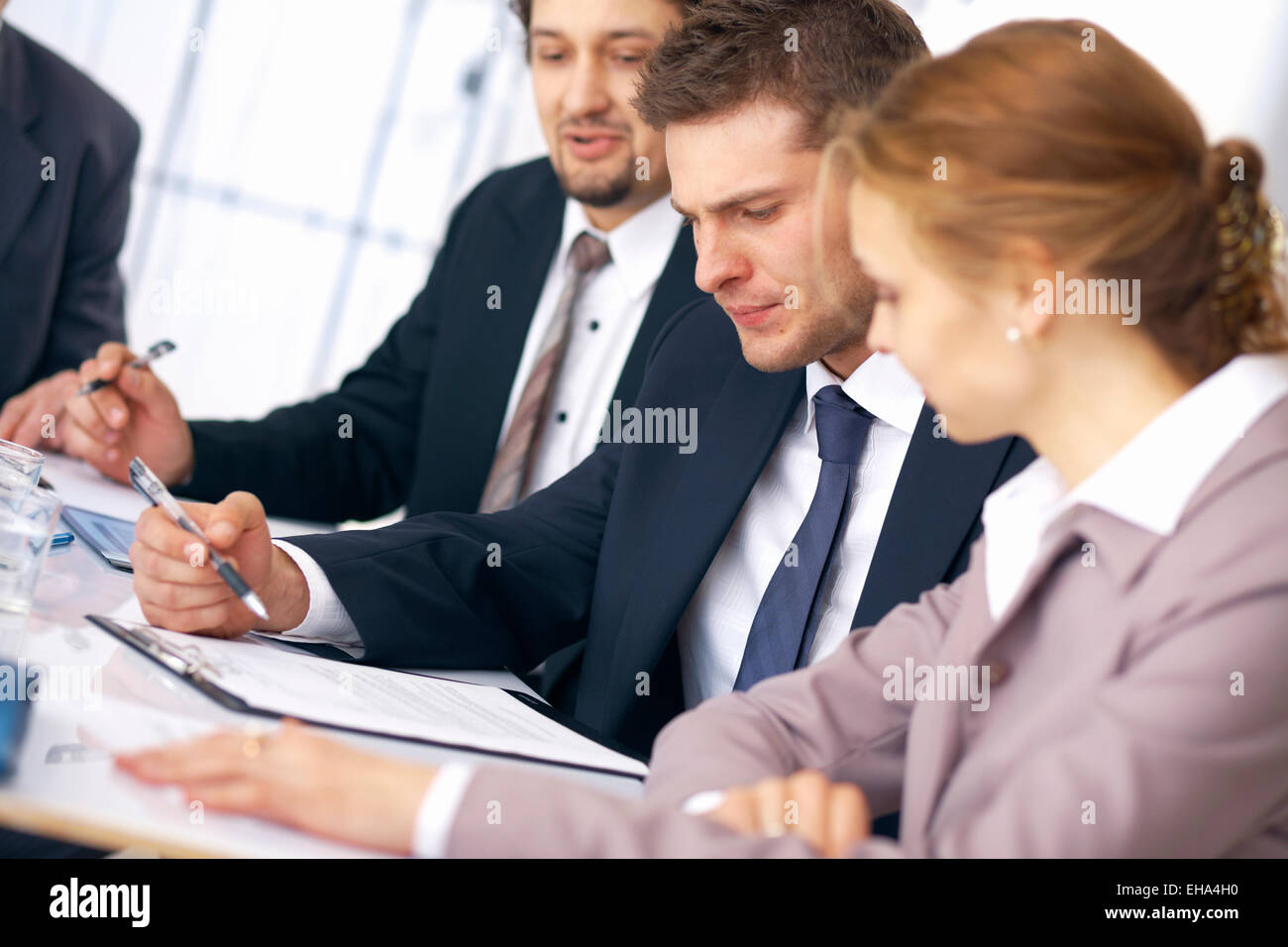 Group of business people working on some documents at the office Stock ...