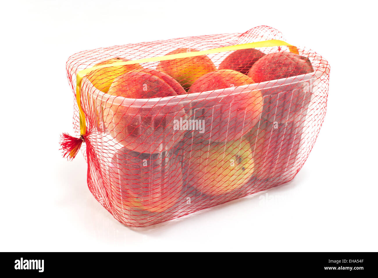 Fresh peaches in plastic bowl isolated on white Stock Photo - Alamy