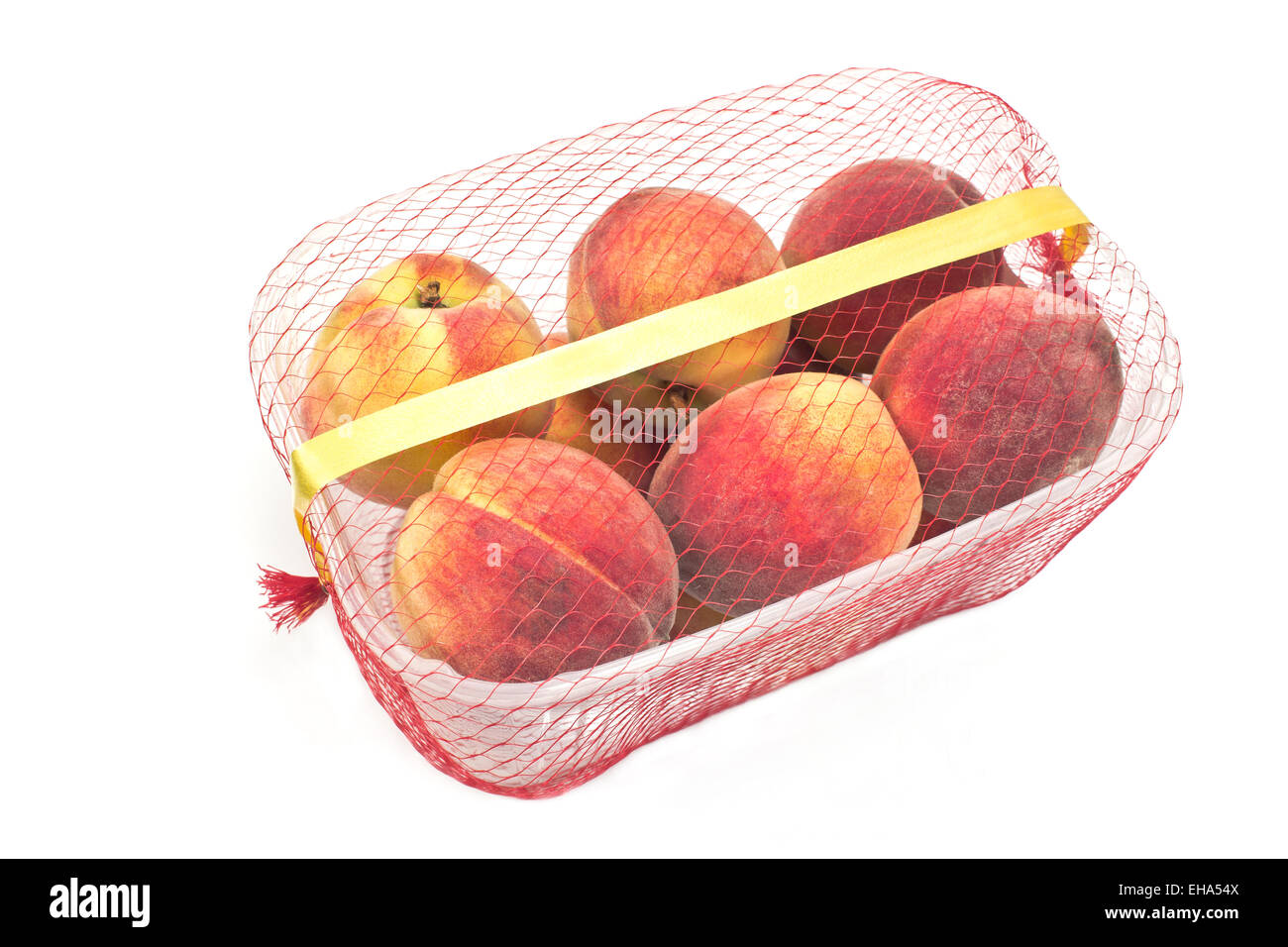 Fresh peaches in plastic bowl isolated on white Stock Photo - Alamy