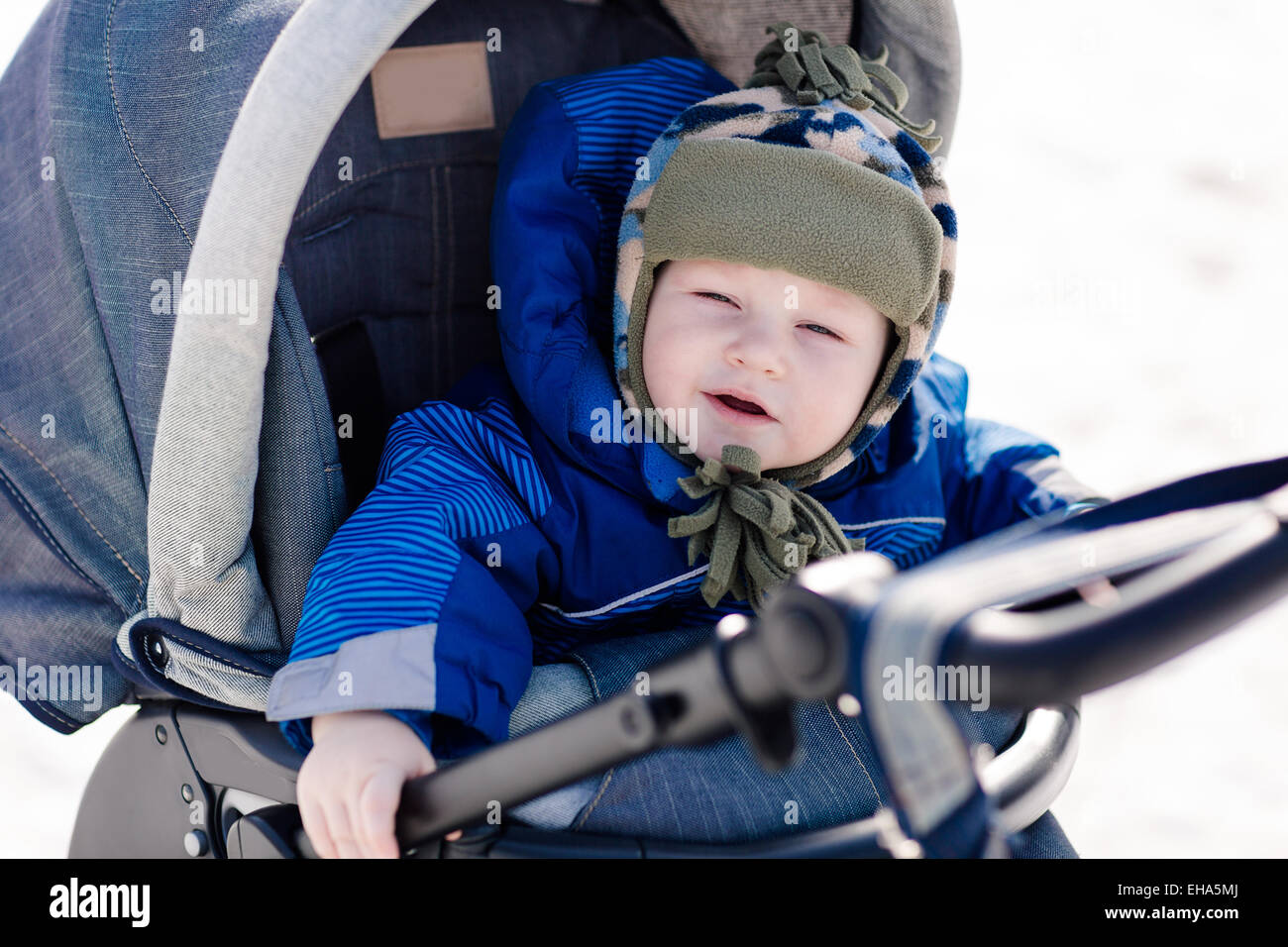 Cute little baby in a stroller outdoor in winter Stock Photo - Alamy
